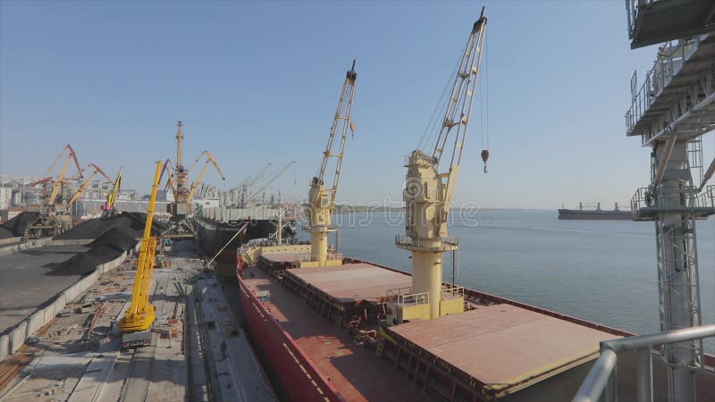 Loading a Tanker in the Port. Loading a Cargo Ship at the Seaport Stock ...