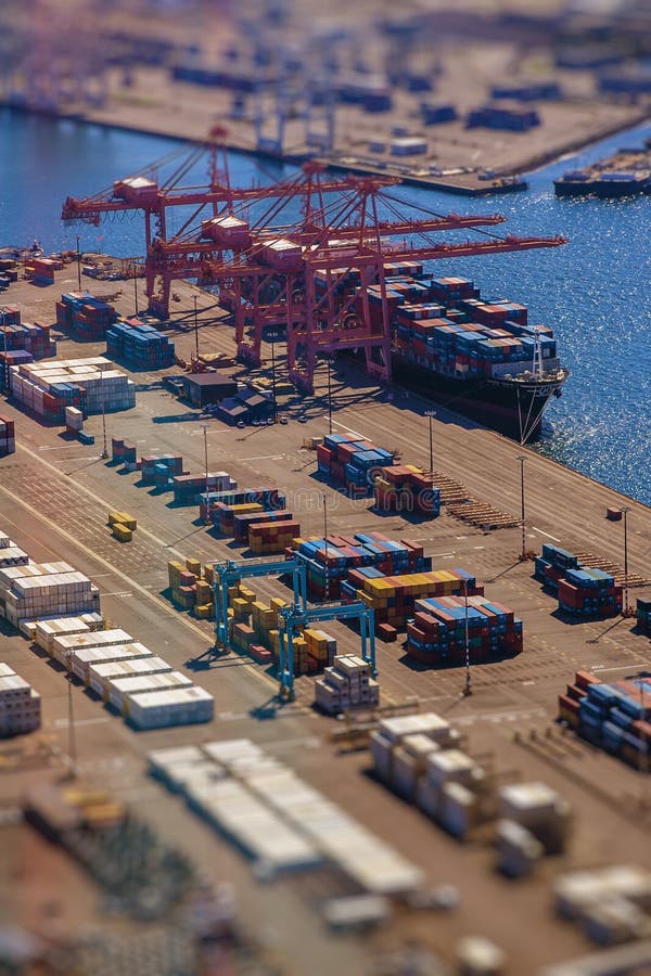 Tilt Shift of Shipping Port with Containers and Loading Transport Ship ...