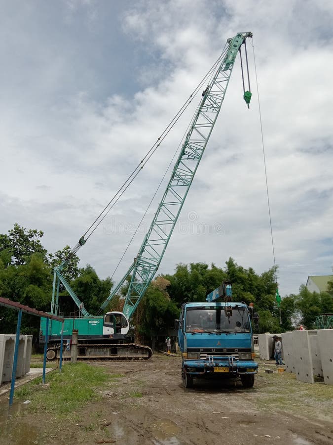 The Process of Loading and Unloading Using a Mobile Crane Blocks and ...