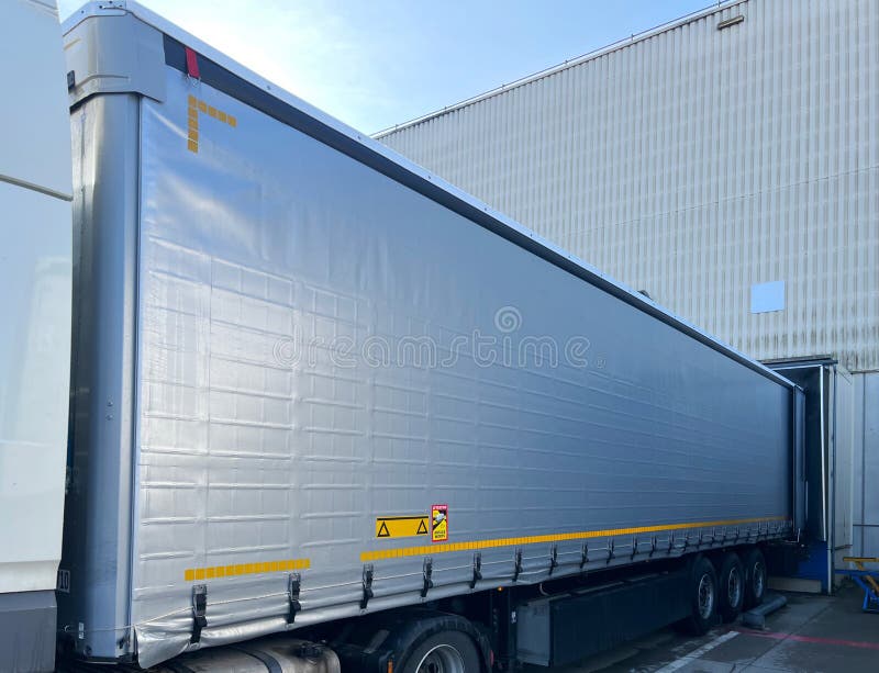 Loading or Unloading Cargo in a Tractor Trailer on a Ramp Stock Photo ...