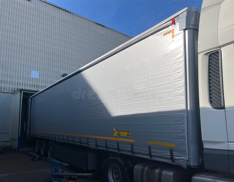 Loading or Unloading Cargo in a Tractor Trailer on a Ramp Stock Image ...