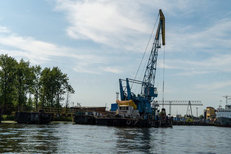 Loading and Unloading Crane Mounted on a Small Barge Stock Photo ...