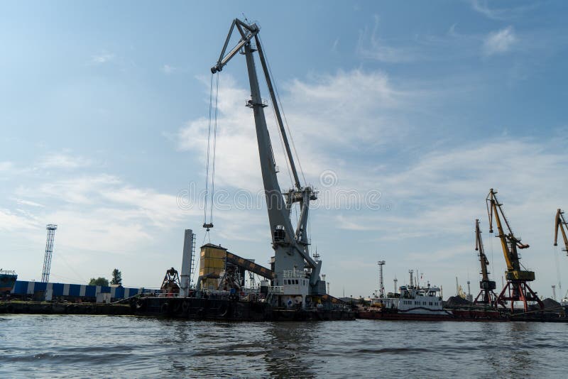 Loading and Unloading Crane Mounted on a Small Barge Stock Photo ...