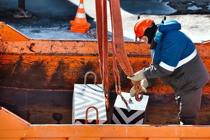 Loading and Unloading Operations on Street. Worker in Warm Winter ...