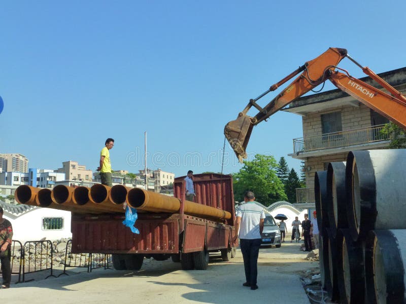 Loading and Unloading Steel Pipe Editorial Stock Photo - Image of ...