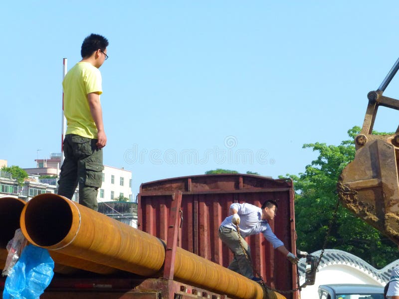 Loading and Unloading Steel Pipe Editorial Stock Photo - Image of cars ...