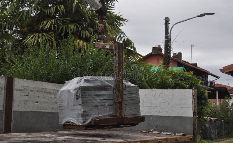 Loading or Unloading of Stone Tiles Stock Image - Image of loading ...
