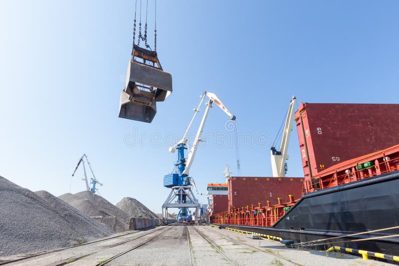 Loading and Unloading of Vessels Stock Photo - Image of cranes, blue ...