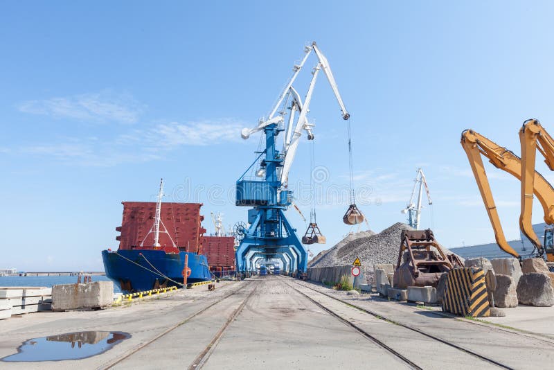 Loading and Unloading of Vessels Stock Image - Image of loading ...