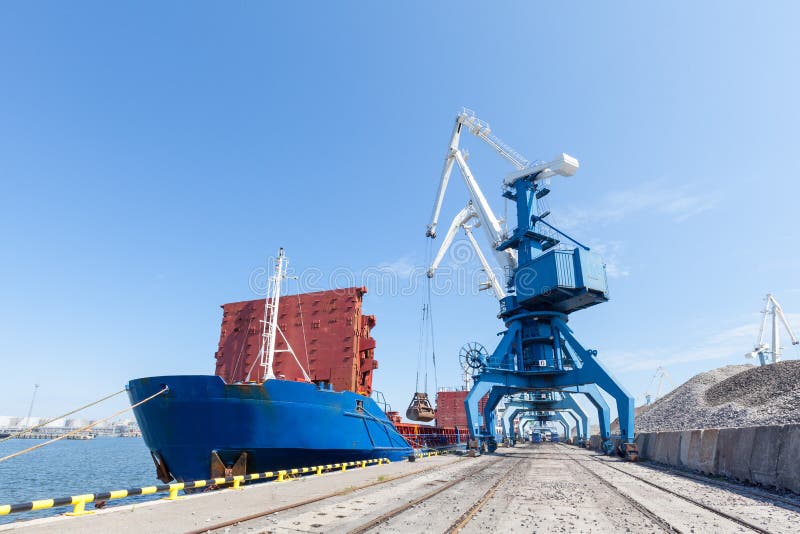 Loading and Unloading of Vessels Stock Photo - Image of heavy, shipping ...