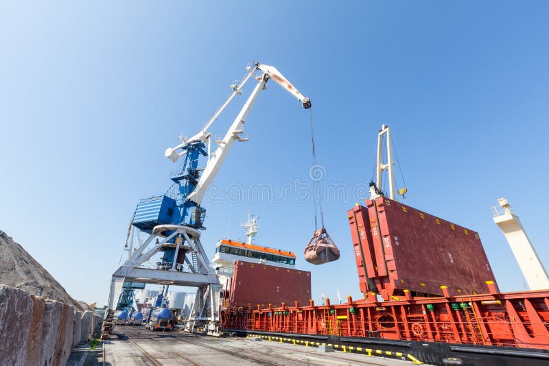 Loading and Unloading of Vessels Stock Photo - Image of cranes, blue ...