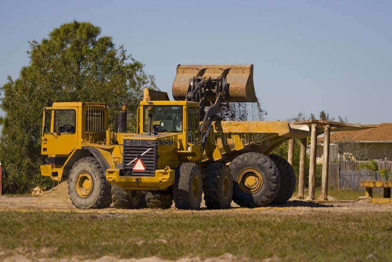 Loading up a dump truck stock image. Image of building - 4452495