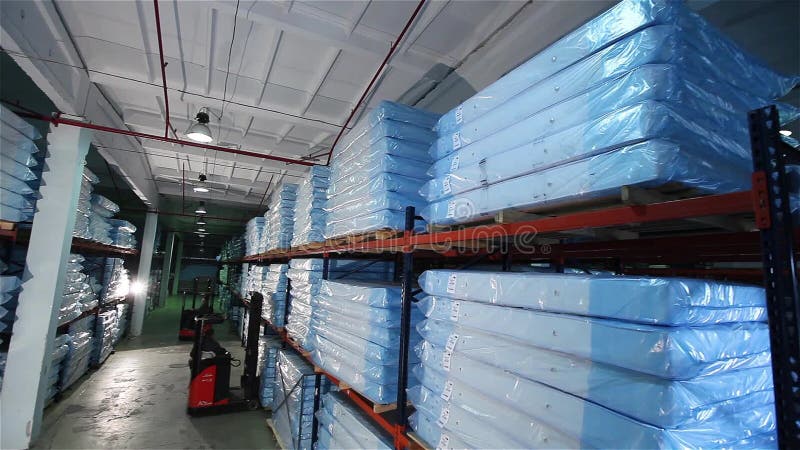 The Loader Loads a Warehouse Mattresses, Orthopedic Mattresses on ...