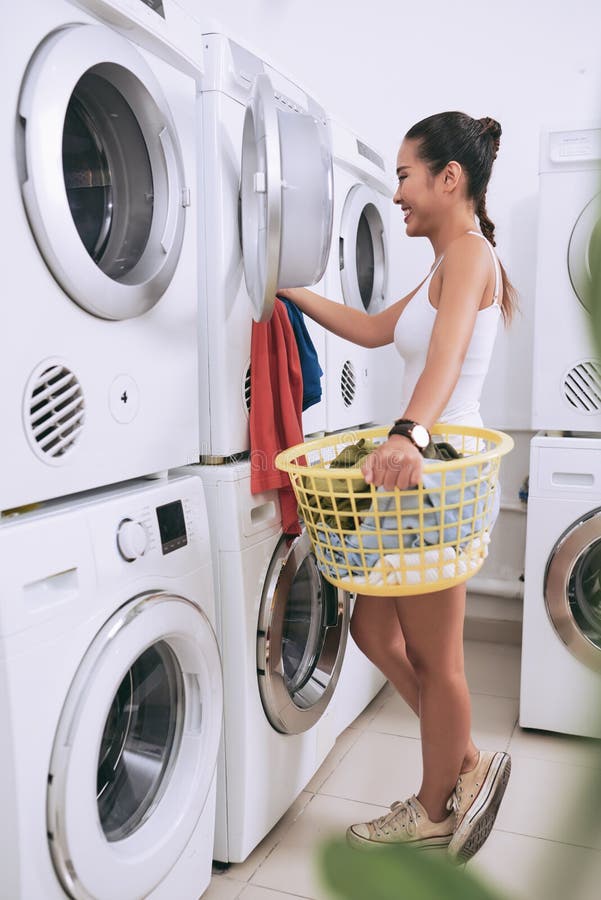 Loading washing machine stock photo. Image of college - 129217450