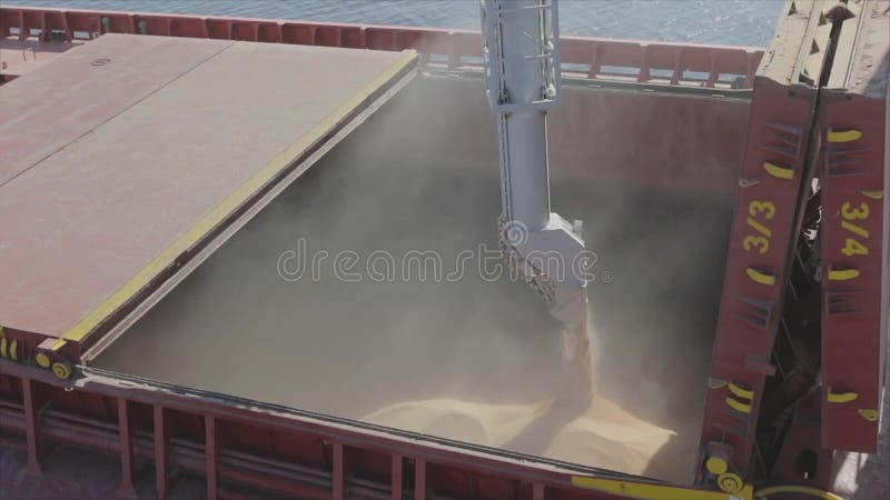 Loading Grain into a Cargo Ship for Transportation by Sea. the Ship is ...