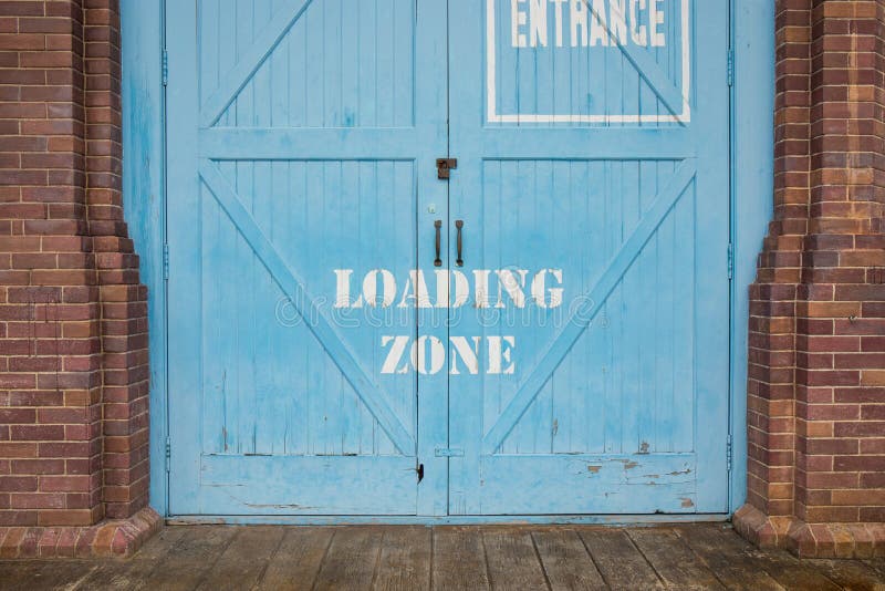 Loading Zone Painted on the Blue Wood Door Stock Photo - Image of ...