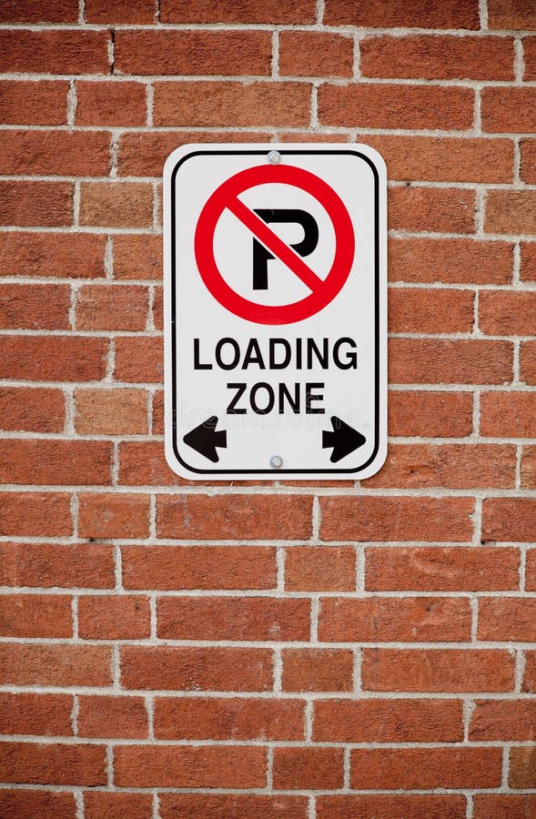 Loading Zone Sign On Brick Background Stock Image - Image of loading ...