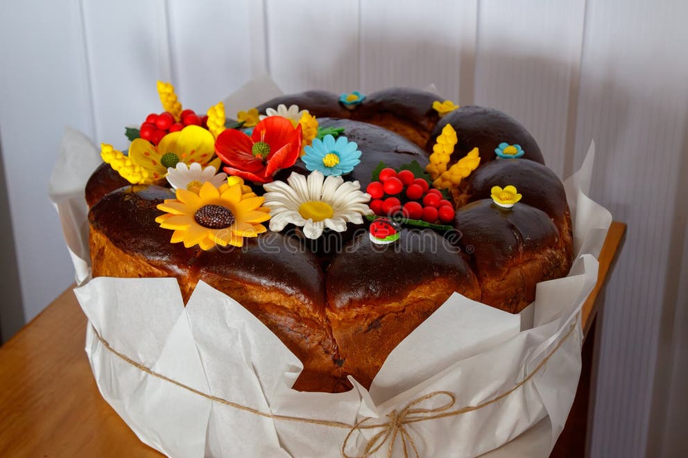 A Loaf of Bread with Flowers on Top of it Stock Photo - Image of edges ...