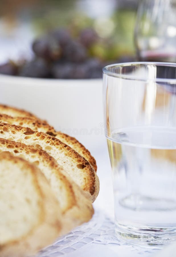 Loaf of Bread and Glass of Water on Table Close Up Stock Photo - Image ...