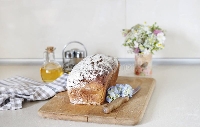 Loaf of Bread, Jar with Honey and Summer Flowers on the Table Stock ...