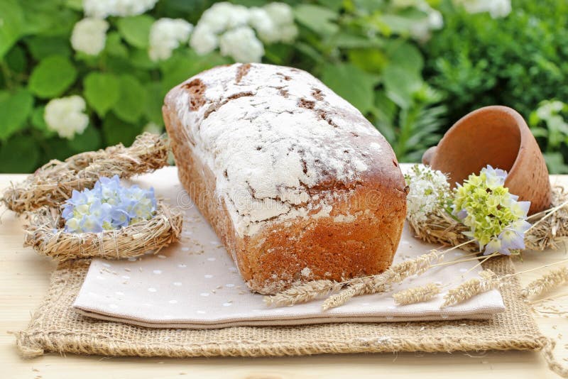 Loaf of Bread, Jar with Honey and Summer Flowers on the Table Stock ...