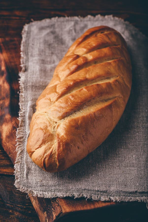 A loaf of bread on a table stock photo. Image of delicious - 156731060