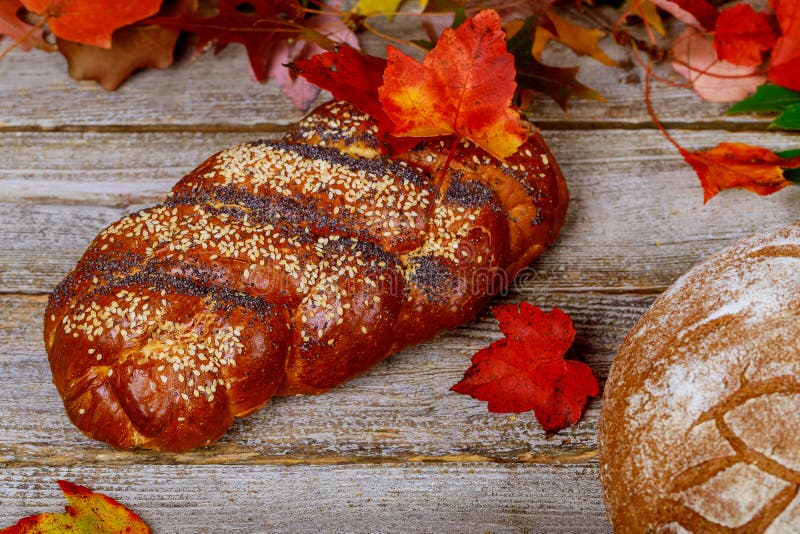 Loaf of Bread among the Yellow Autumn Leaves. Harvest Time Stock Image ...