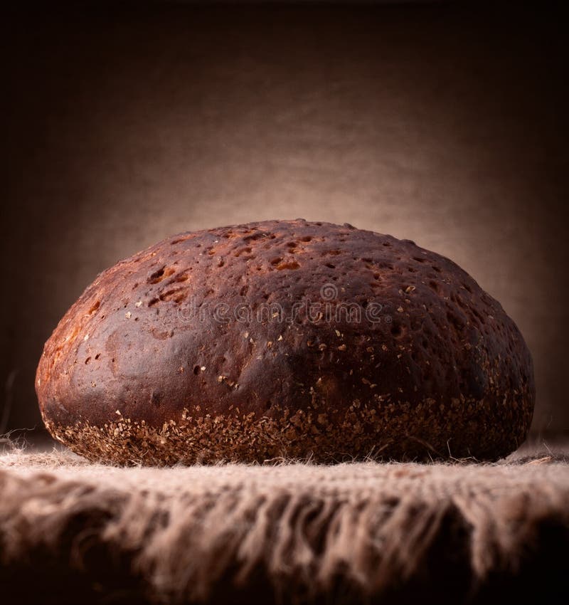 Baker Man Holding Rustic Loaf of Bread and Wheat in Hands Stock Photo ...