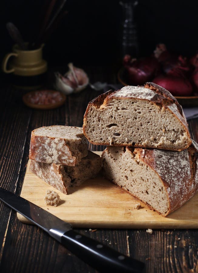 A Loaf of Rye Bread in Rustic Style Stock Photo - Image of loaf, wood ...