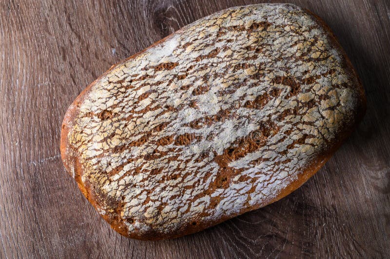 A Loaf of Rye Bread on a Wooden Table Stock Image - Image of food ...