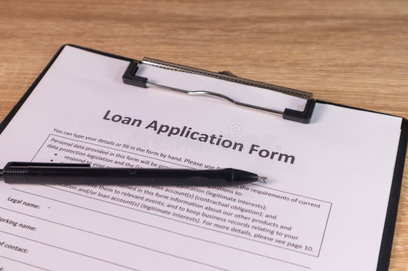 Loan Application Form on the Wooden Table with Pen Stock Image - Image ...