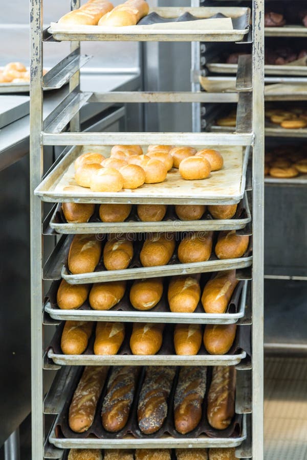 Loaves of Bread in Commercial Kitchen Stock Photo - Image of steel ...