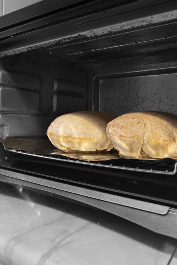 Loaves of Bread Cooked in an Electric Oven. Stock Image - Image of ...