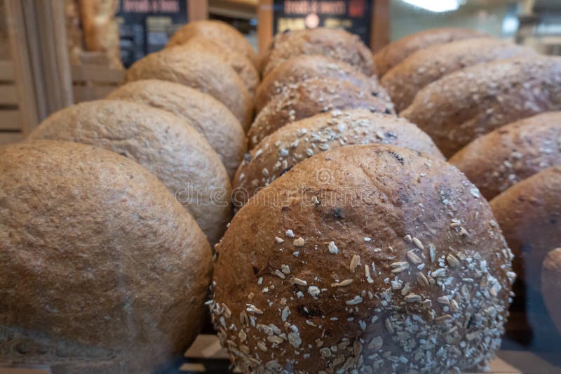 Loaves of Bread on Display in Bakery Stock Photo - Image of grocery ...