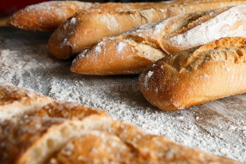 Loaves of Bread on Work Table Stock Photo - Image of homemade, baguette ...