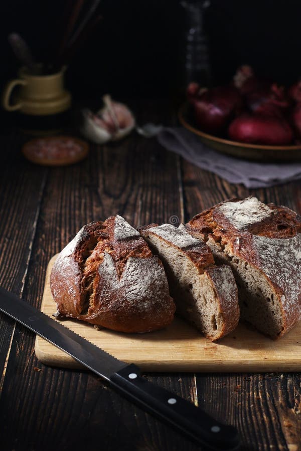 A Loaf of Rye Bread in Rustic Style Stock Photo - Image of loaf, wood ...