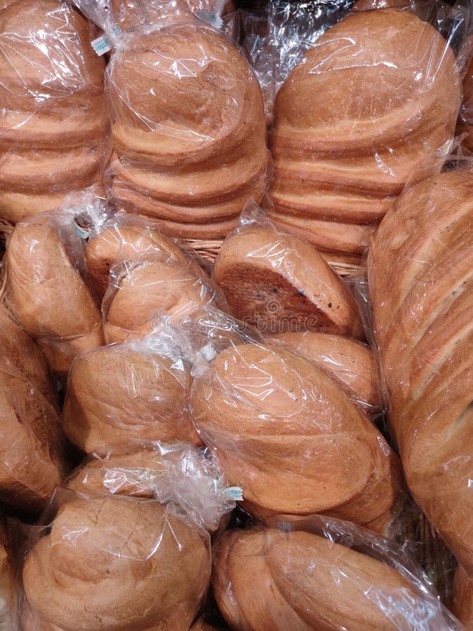 Loaves of White Bread Packed in Cellophane Stock Photo - Image of white ...