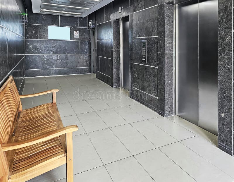 Lobby with Elevator Doors and Wooden Bench Stock Photo - Image of metal ...