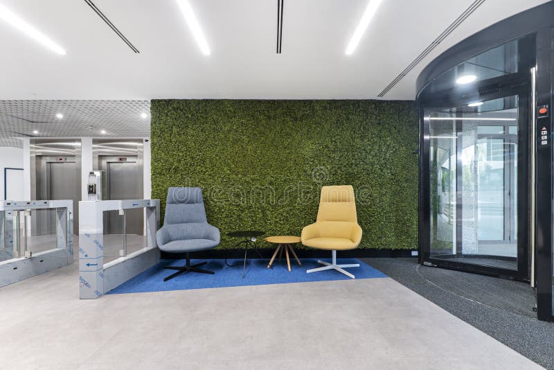 Lobby of an Office Building with Round Tables and Armchairs for ...