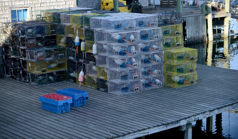 Lobster traps on a dock stock image. Image of buoy, metal - 61784077