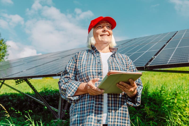 Local Engineer Using Digital Tablet App To Look at Energy Performance ...