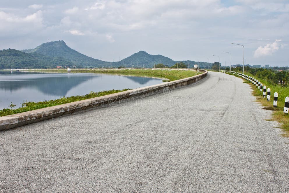 Local road beside a dam stock photo. Image of asphalt - 21603800