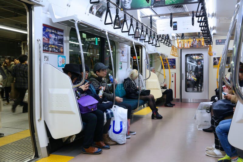 Local train in Tokyo editorial photography. Image of passengers - 342661257