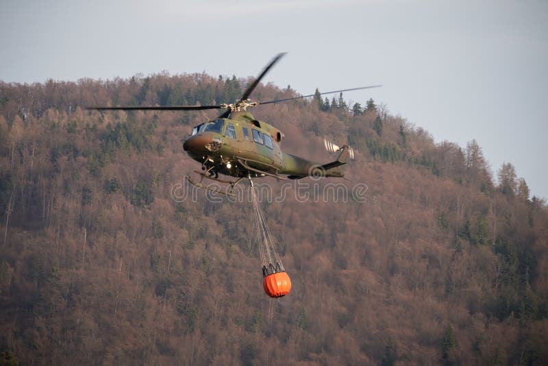 Localized Wildfire with the Helicopter Dropping Water Stock Image ...