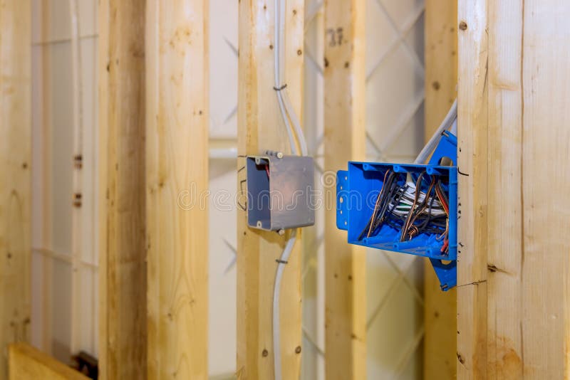 Located on Wall Above Wooden Frame Beam is a Plastic Electrical Switch ...