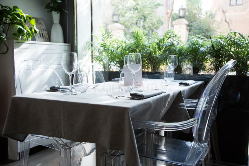 Elegant Restaurant Table with Cutlery, Crockery and Glasses. Stock ...