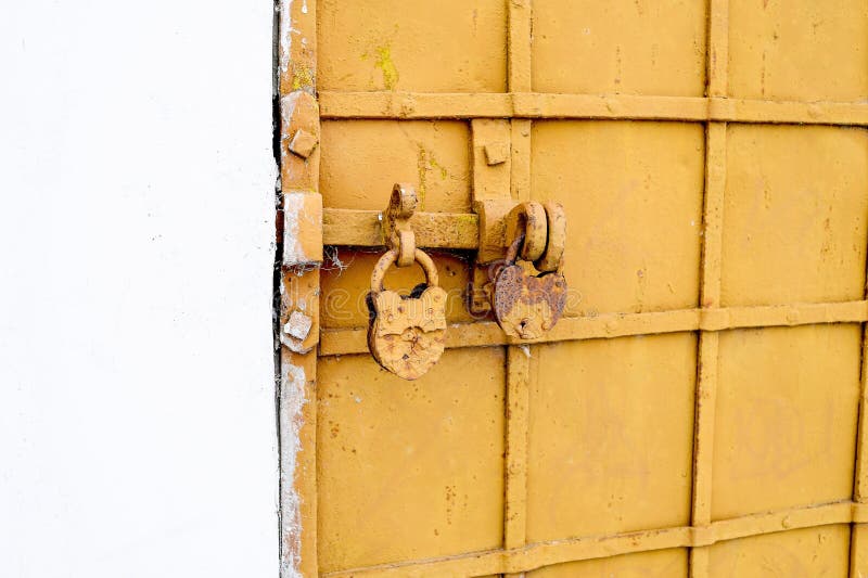 Lock with the Bolt Closed on the Background of the Antique-bound Door ...