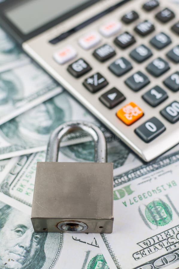 Lock and Calculator on Dollar Bill Background. Stock Photo - Image of ...