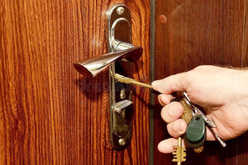 The Key is Inserted into the Door Stock Image - Image of purchase, grey ...