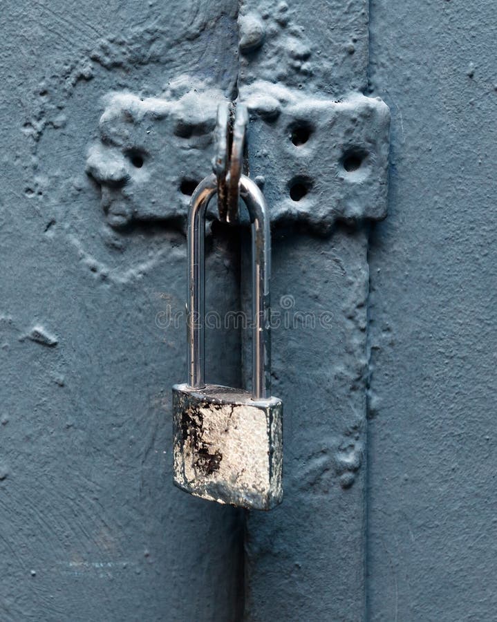 A Lock is Hanging from a Blue Wall Stock Image - Image of rusty, steel ...